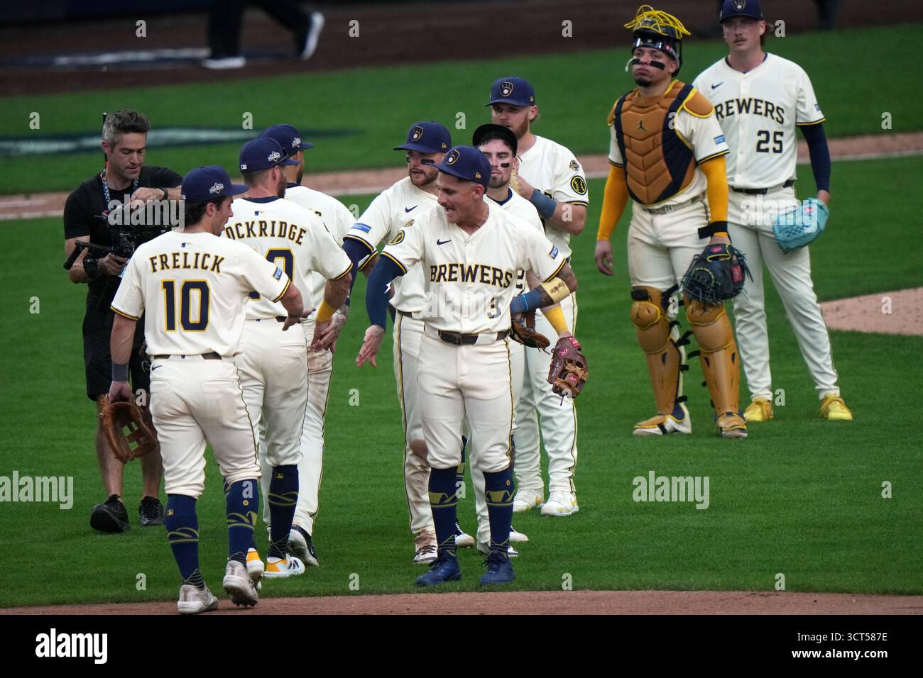 The Milwaukee Brewers celebrate after Game 1 of baseball's National ...