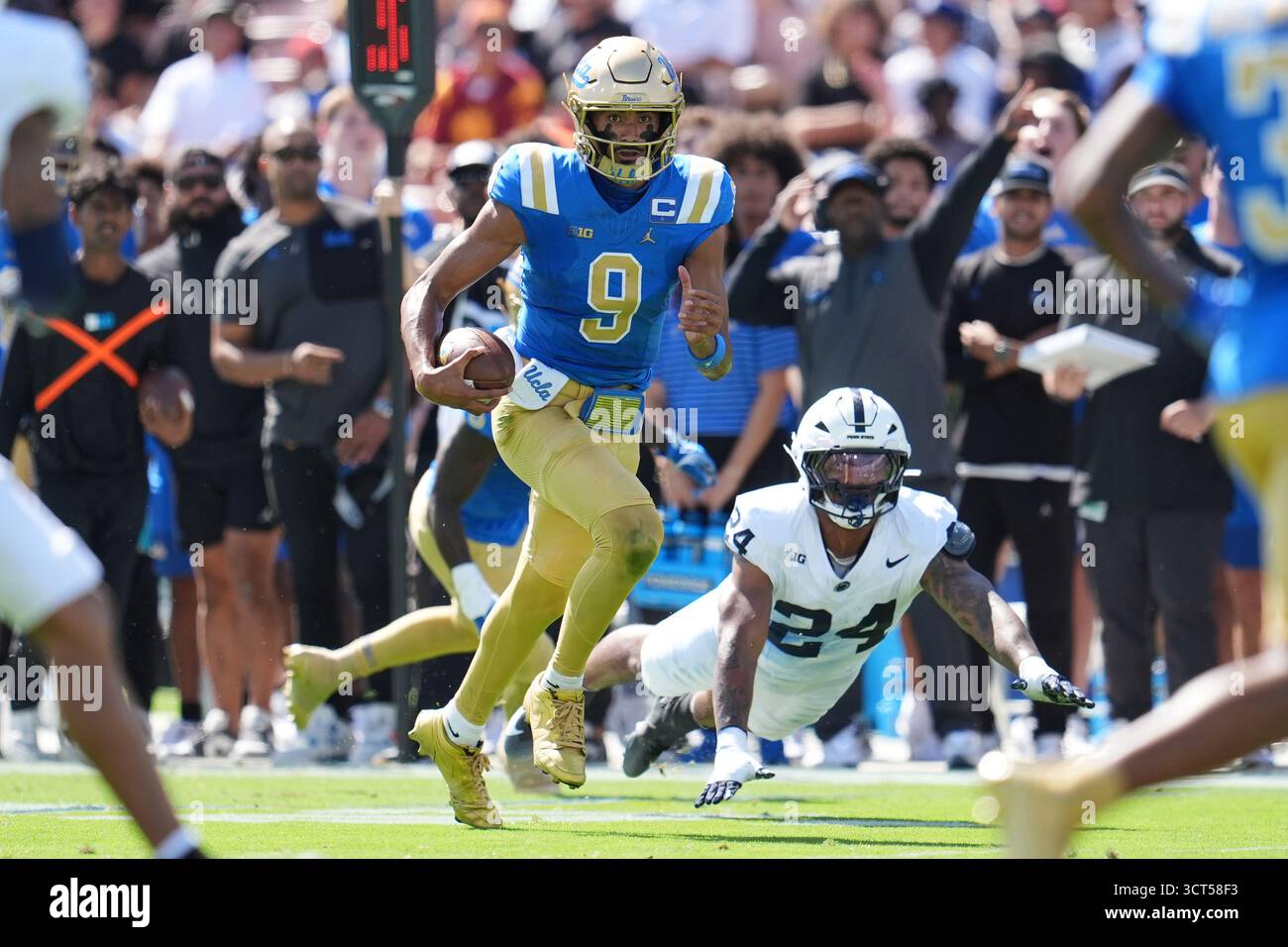 UCLA quarterback Nico Iamaleava (9) runs pat Penn State linebacker ...