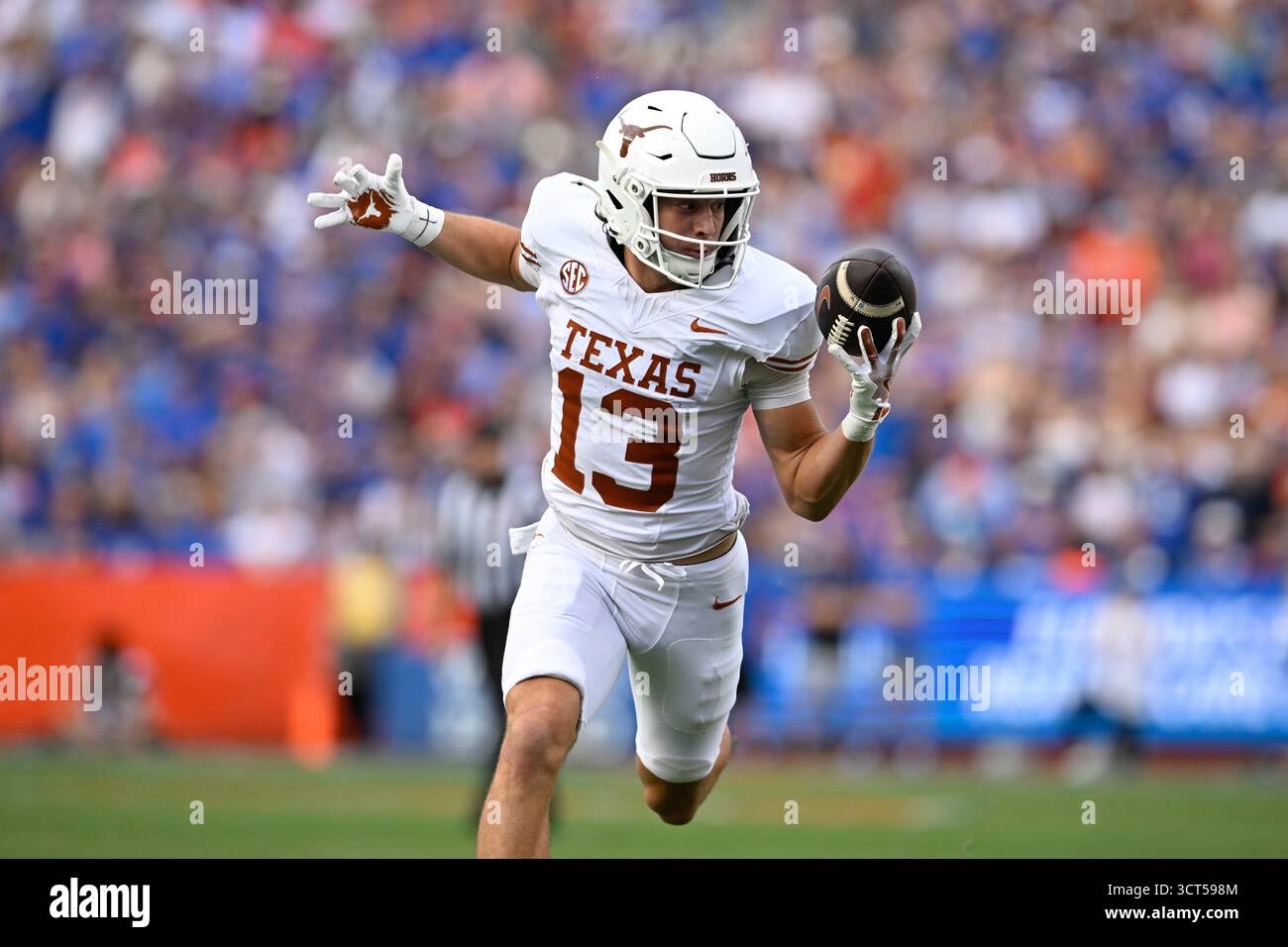Texas wide receiver Parker Livingstone (13) catches a pass for a 33 ...