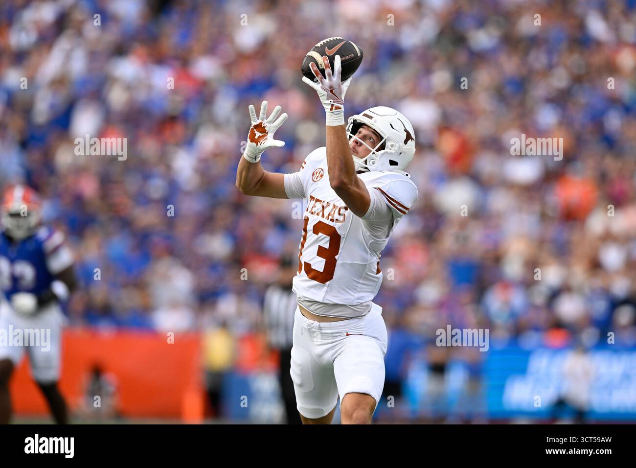 Texas wide receiver Parker Livingstone (13) catches a pass for a 33 ...