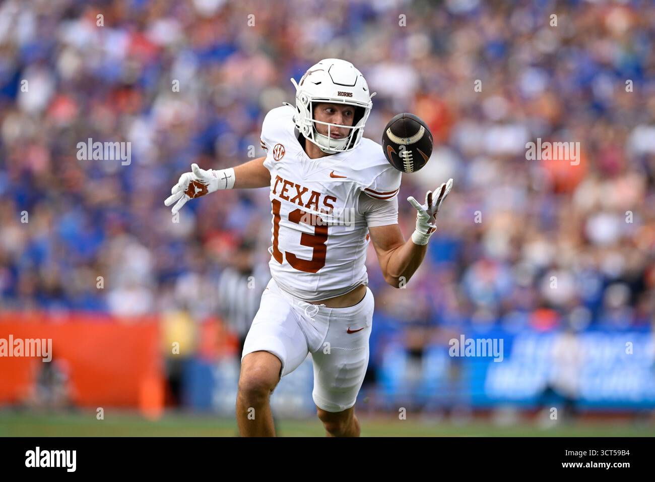 Texas wide receiver Parker Livingstone (13) catches a pass for a 33 ...