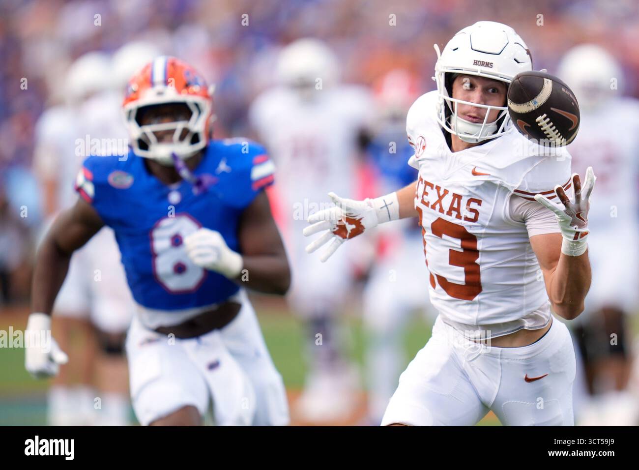 Texas wide receiver Parker Livingstone, right, makes a reception in ...