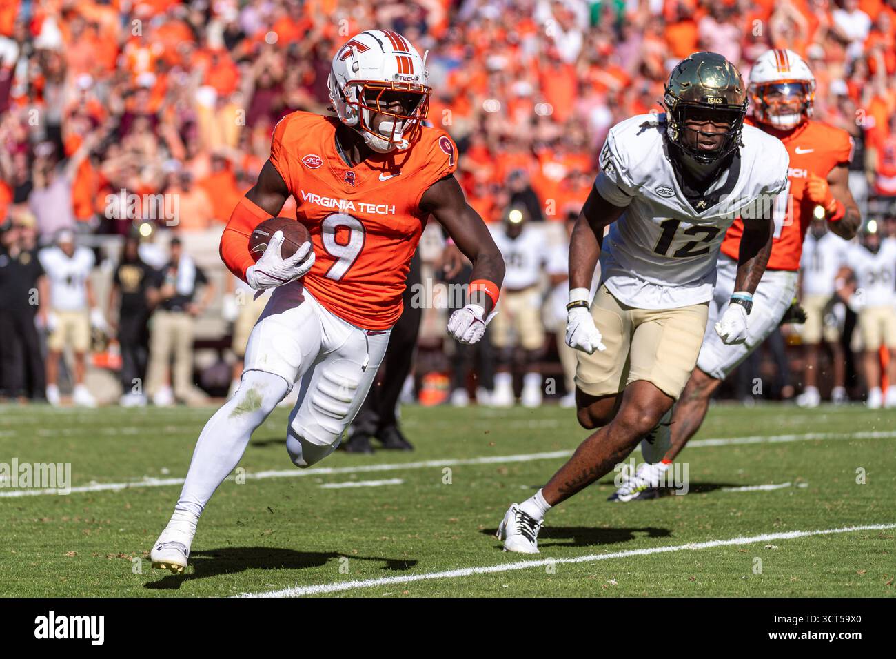 Virginia Tech cornerback Isaiah Brown-Murray (9) runs an interception ...