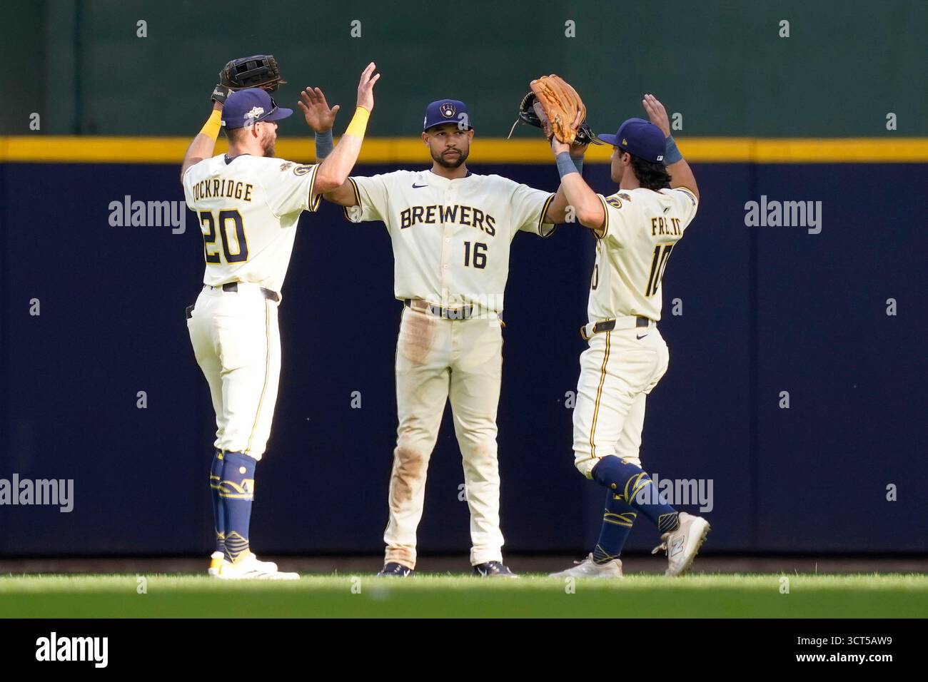 Milwaukee Brewers players, from left, Brandon Lockridge, Blake Perkins ...