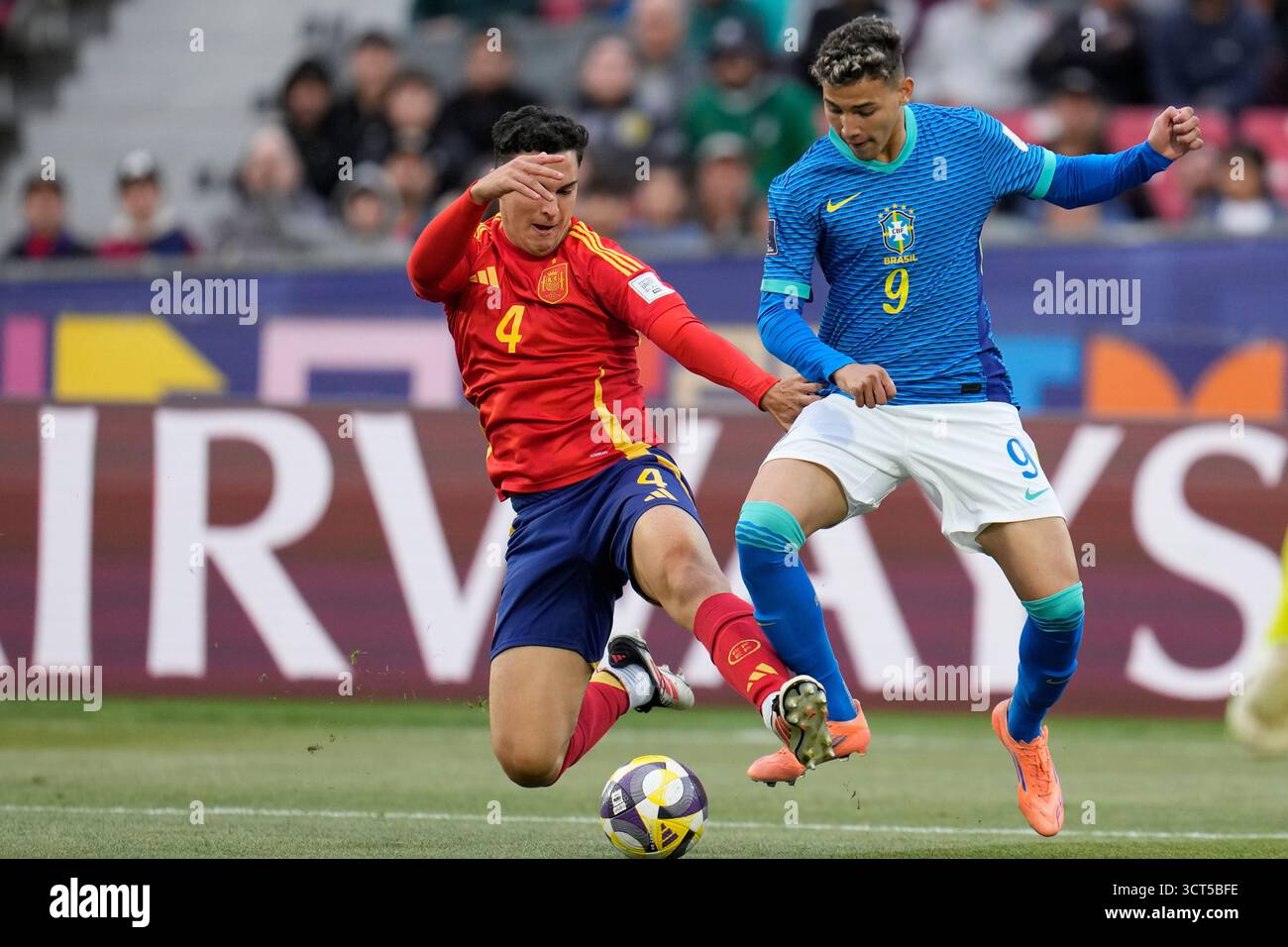 Spain's Jon Martin (4) and Brazil's Deivid Washington battle for the ...