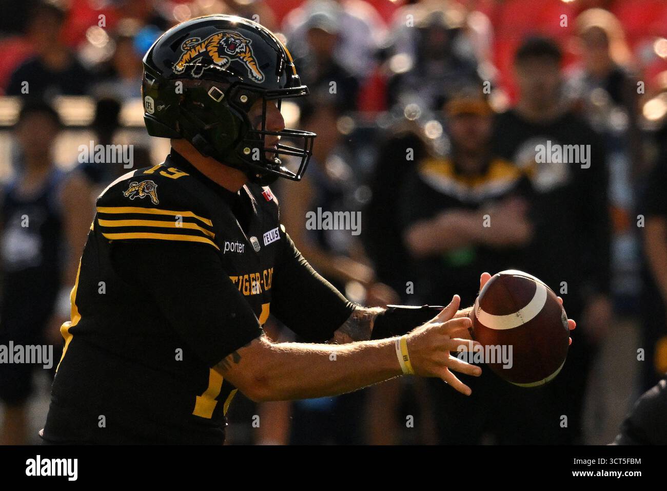Hamilton Tiger-Cats quarterback Bo Levi Mitchell takes the snap during ...