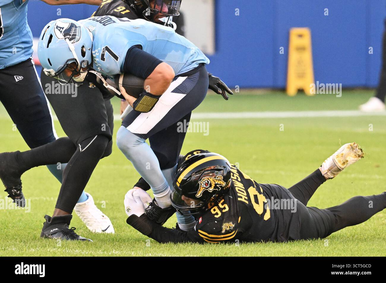 Toronto Argonauts' quarterback Jarret Doege is sacked by Hamilton Tiger ...