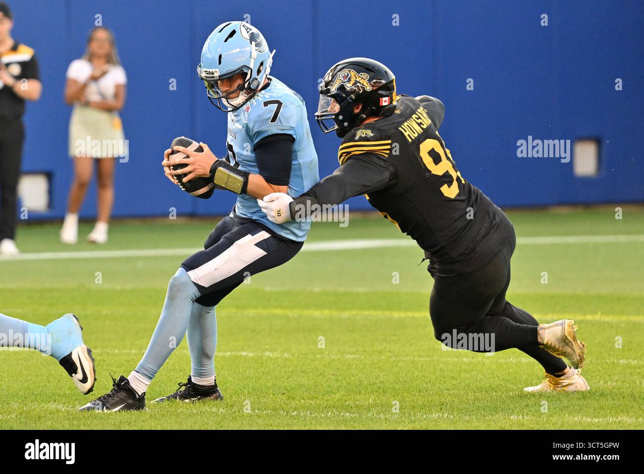 Toronto Argonauts' quarterback Jarret Doege is sacked by Hamilton Tiger ...