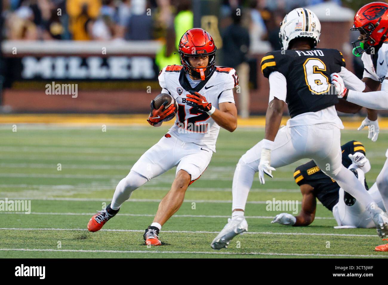 Oregon State wide receiver Zack Card (12) runs after a catch while ...