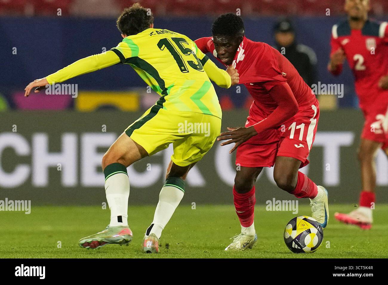 Australia's Jaylan Pearman, left, grabs Cuba's Romario Torres during a ...