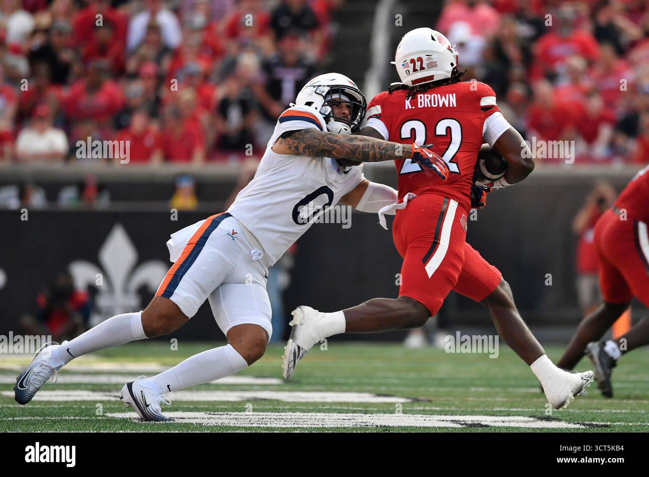 Virginia safety Antonio Clary (0) grabs Louisville Cardinals running ...