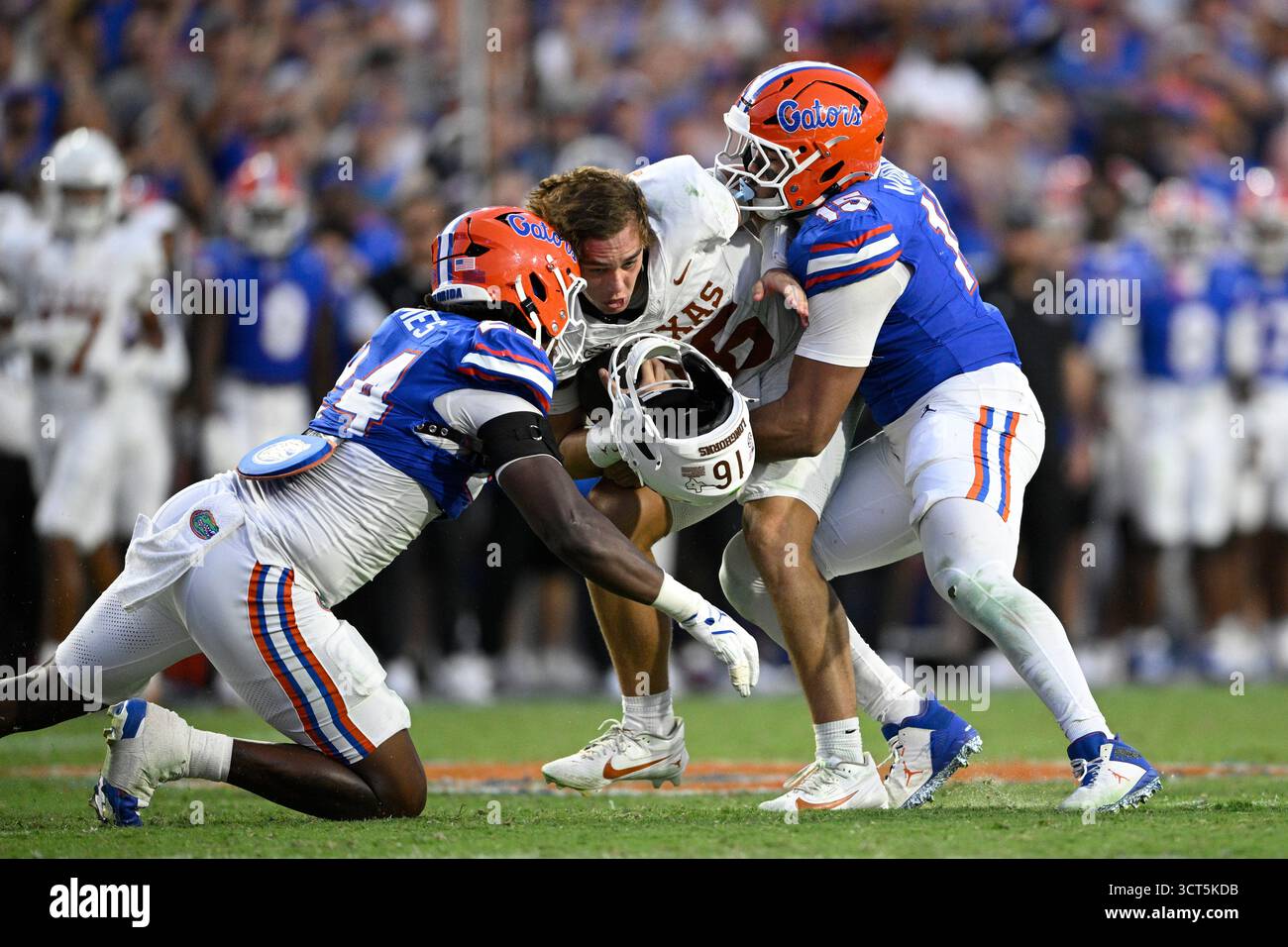 Texas quarterback Arch Manning (16) loses his helmet while getting ...