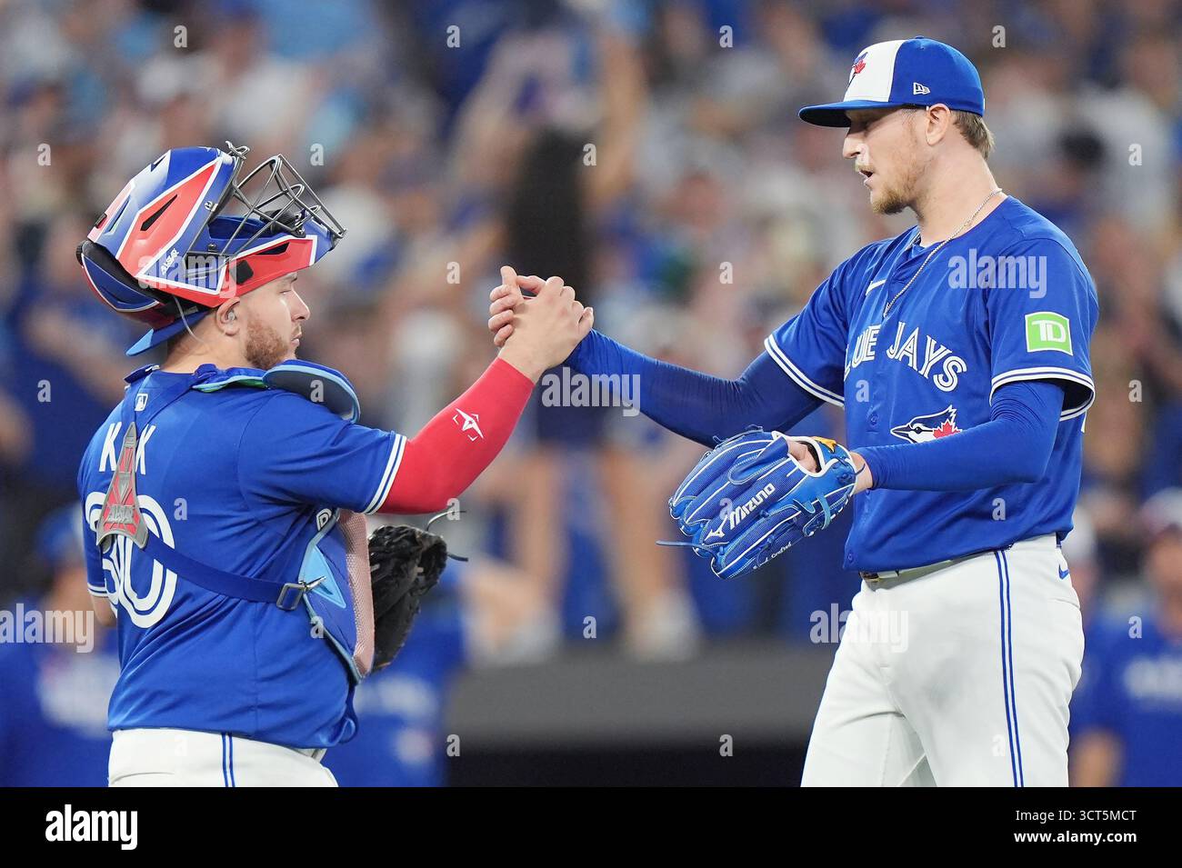 Toronto Blue Jays catcher Alejandro Kirk (30) and pitcher Jeff Hoffman ...