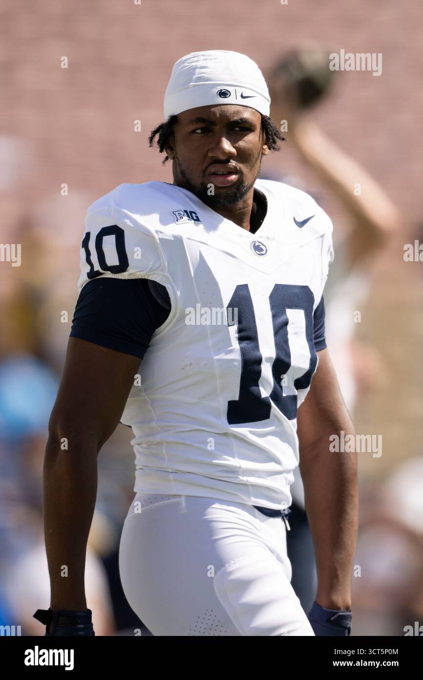 Penn State running back Nicholas Singleton (10) walks on the field ...