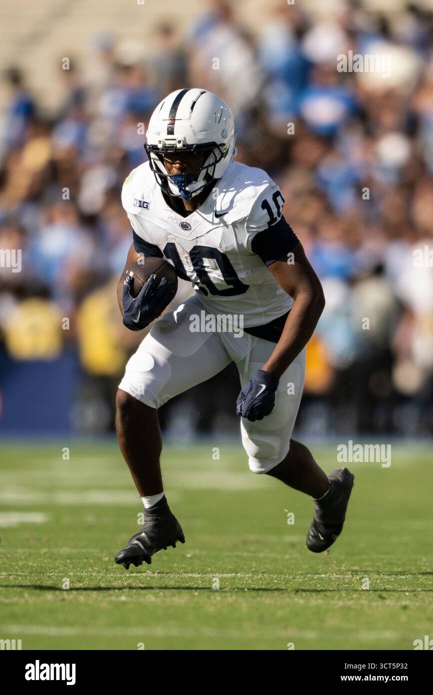 Penn State running back Nicholas Singleton (10) runs with the ball ...