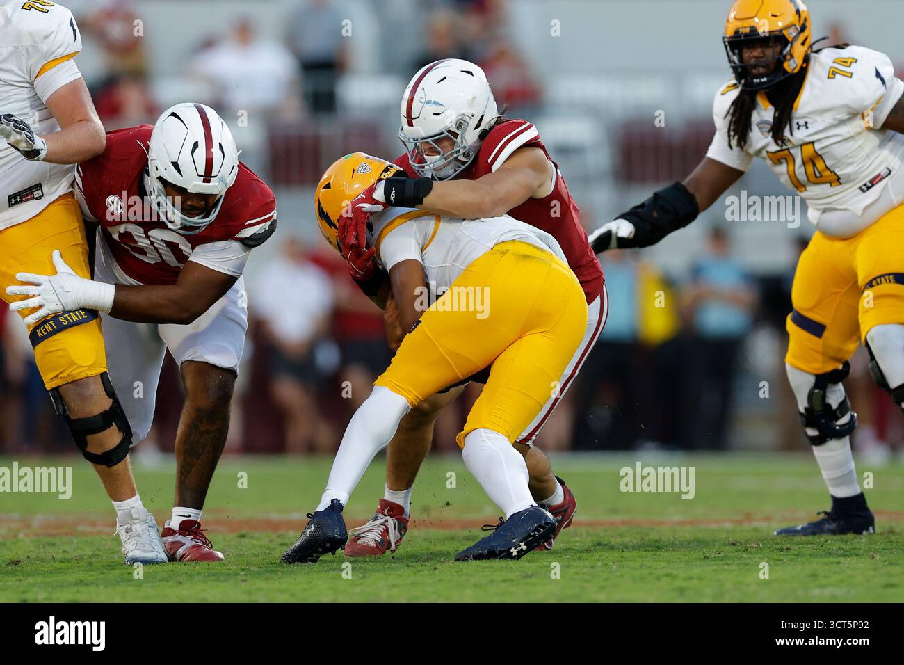 Oklahoma defensive lineman Taylor Wein, center right, sacks Kent State ...