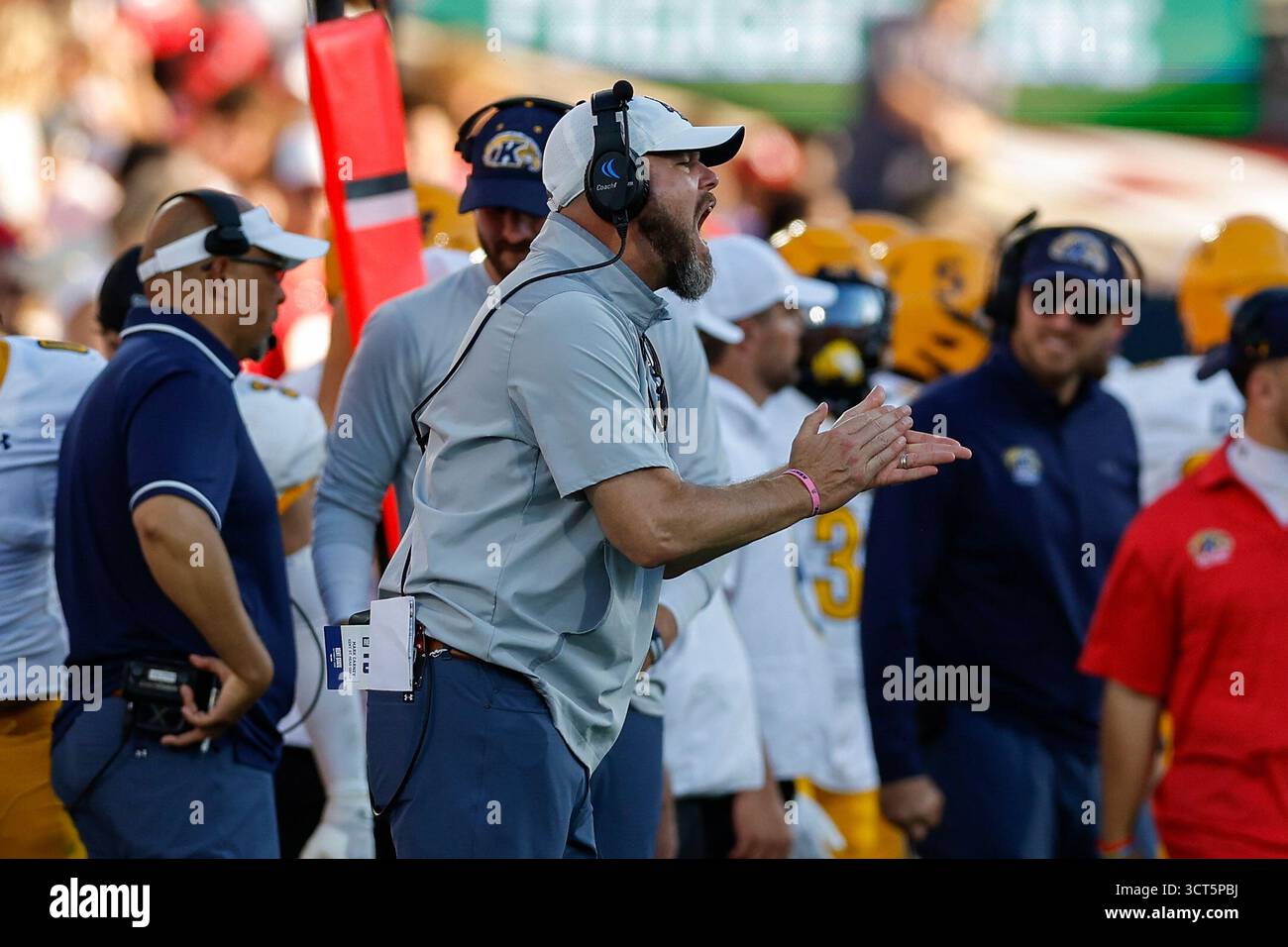 Kent State head coach Mark Carney, center, yells to his team during a ...