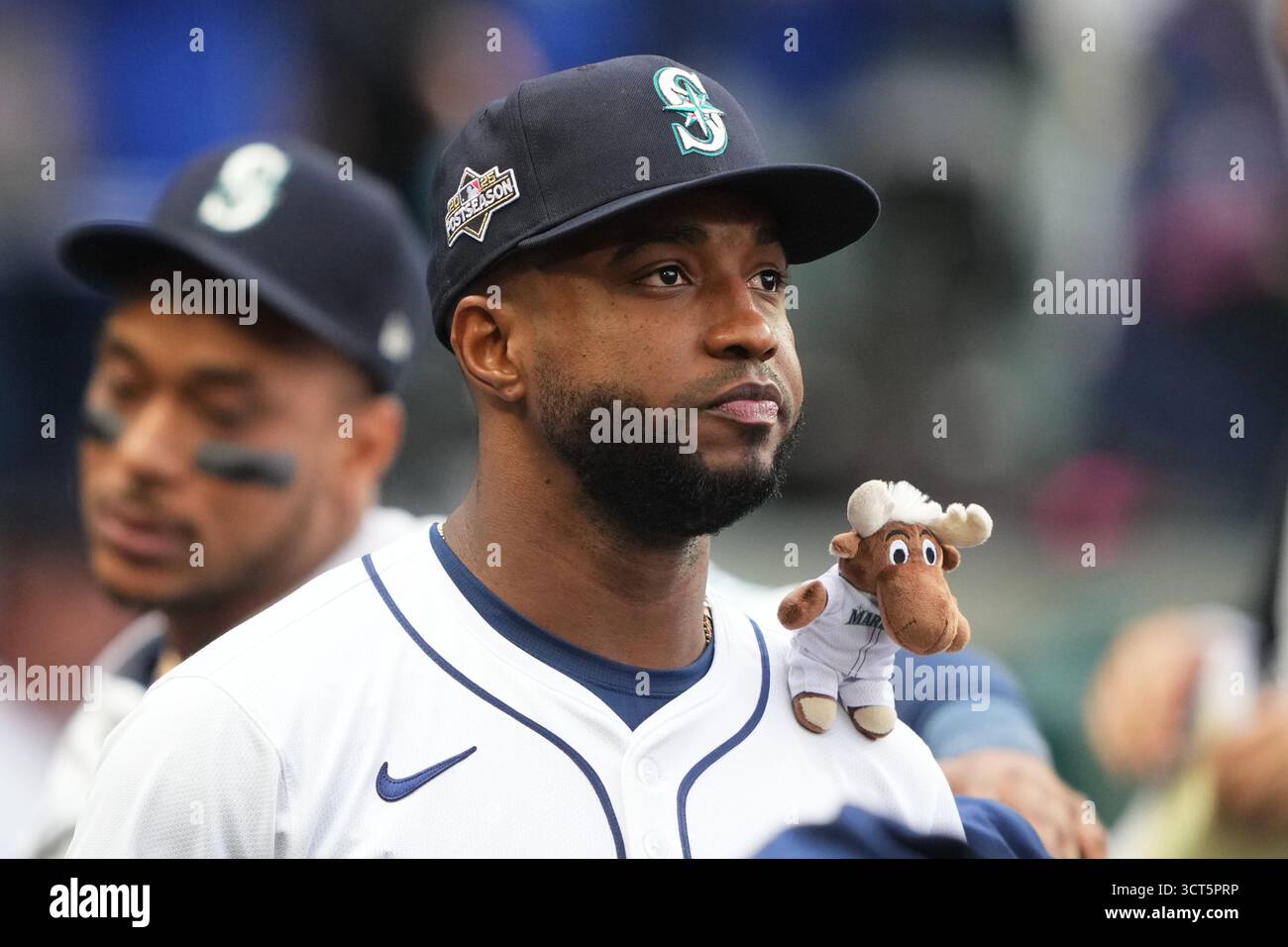 Seattle Mariners right fielder Victor Robles watches from the dugout ...