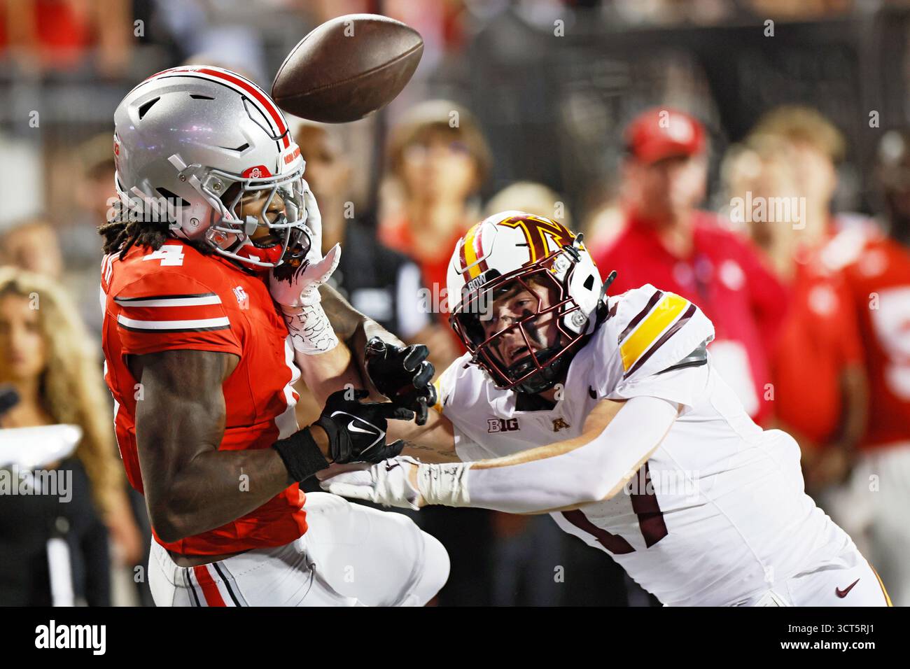 Minnesota defensive back John Nestor, right, deflects a pass intended ...