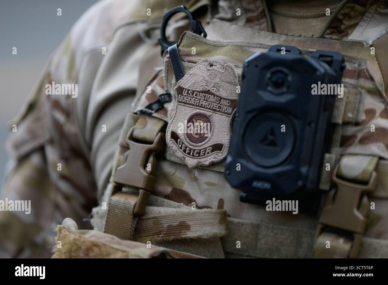 A Customs and Border Protection officer stands outside a U.S ...