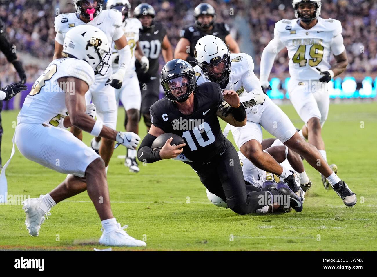 TCU quarterback Josh Hoover (10) is stopped by Colorado defensive back ...