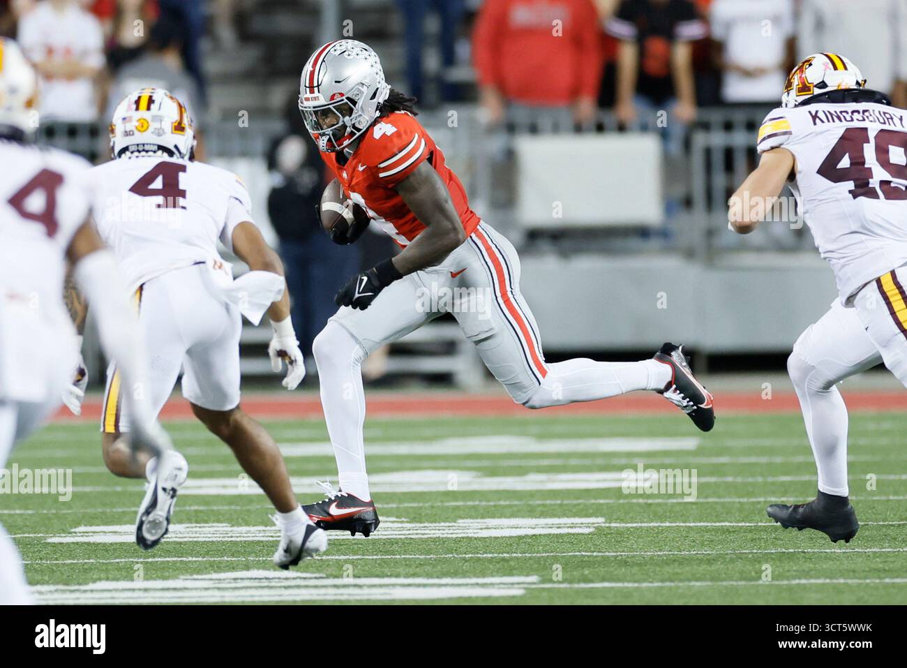 Ohio State receiver Jeremiah Smith runs after a catch against Minnesota ...