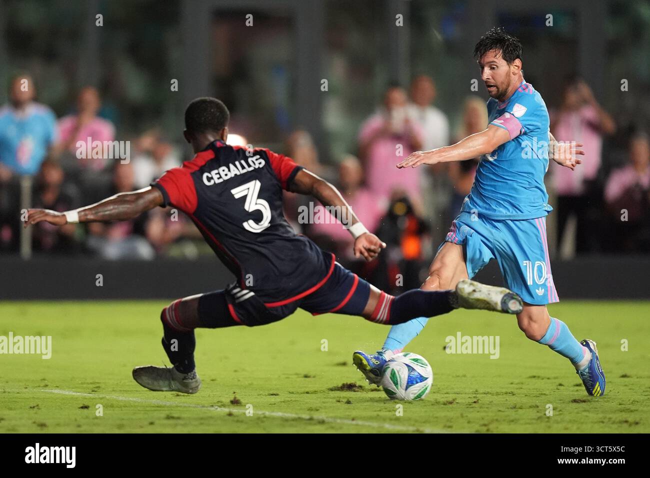 Inter Miami forward Lionel Messi (10) comes under pressure from New England Revolution defender ...