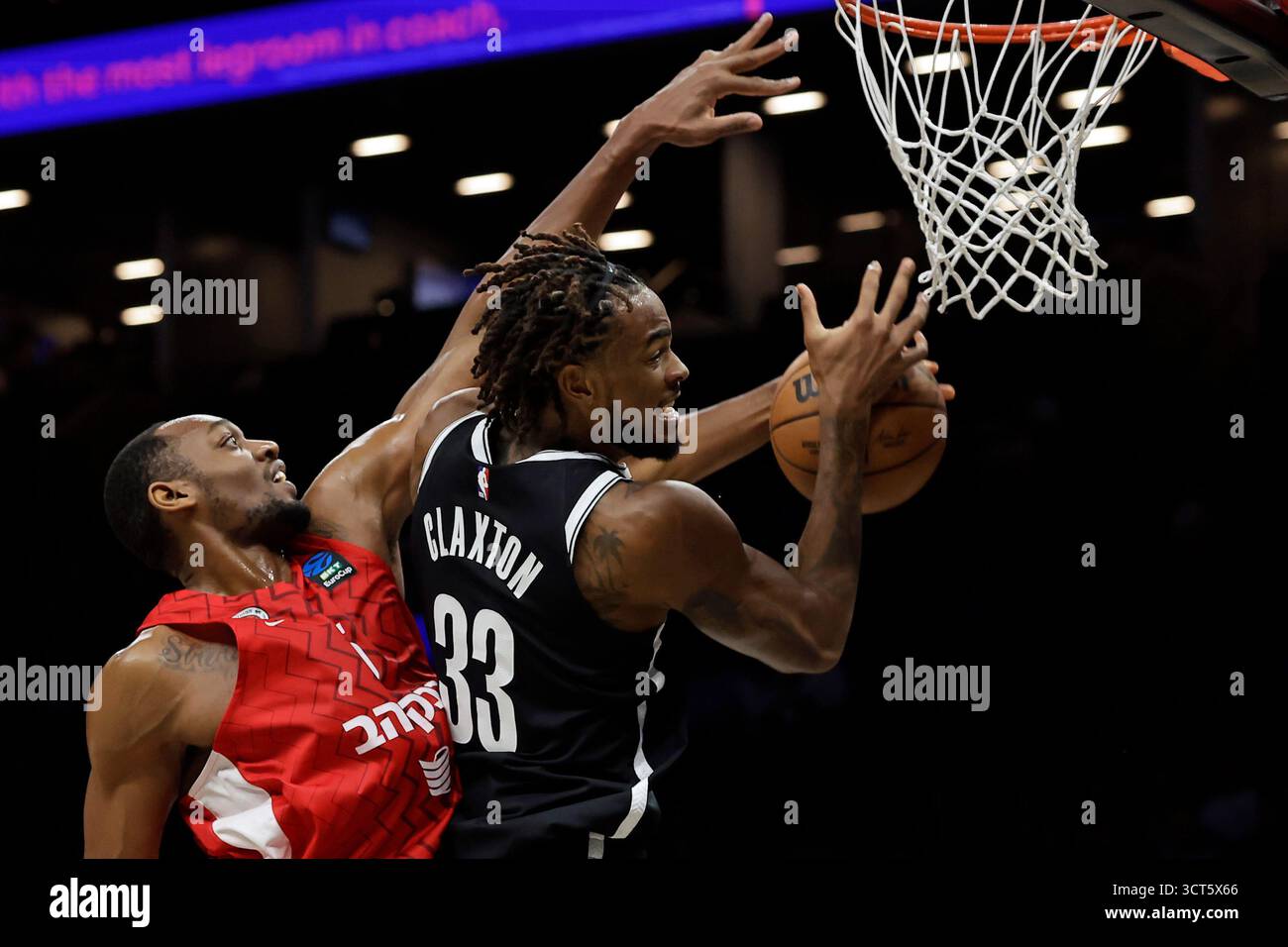 Brooklyn Nets center Nic Claxton (33) grabs a rebound in front of ...