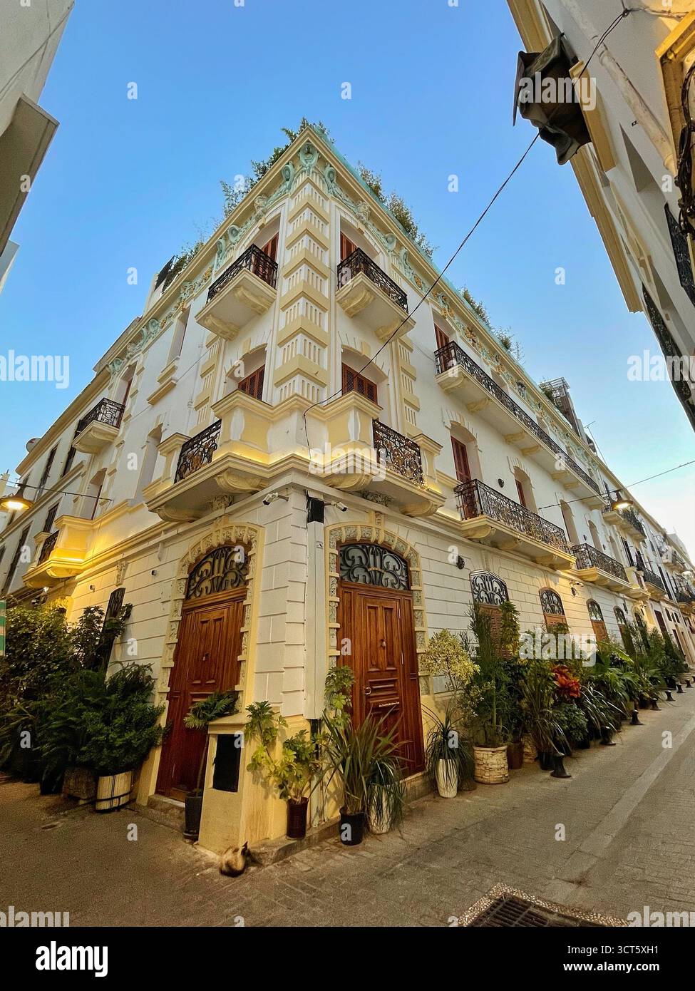 Corner view of a multi-story building in Tangier, Morocco, featuring ...