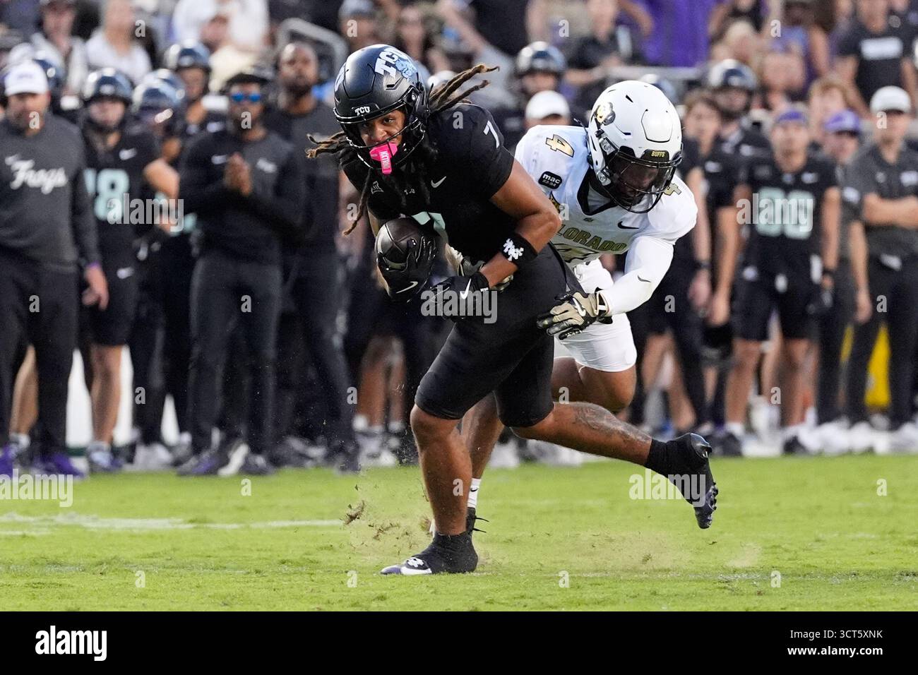TCU wide receiver Jordan Dwyer (7) gains yards after a catch as ...