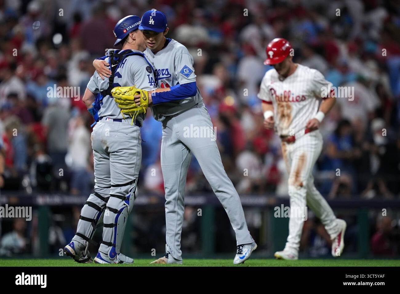 Los Angeles Dodgers' Will Smith, left, and Roki Sasaki celebrate after ...