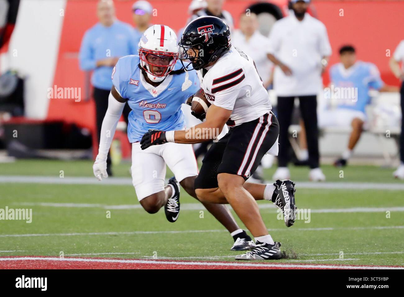 Texas Tech running back Cameron Dickey, right, avoids the tackle ...