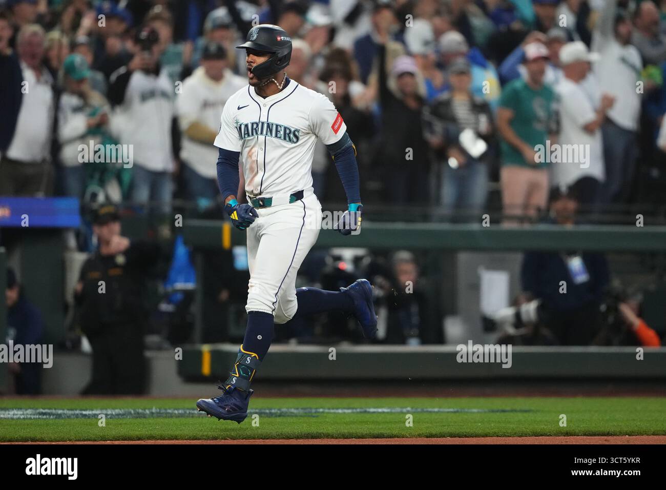 Seattle Mariners' Julio Rodriguez runs after hitting a solo home run ...