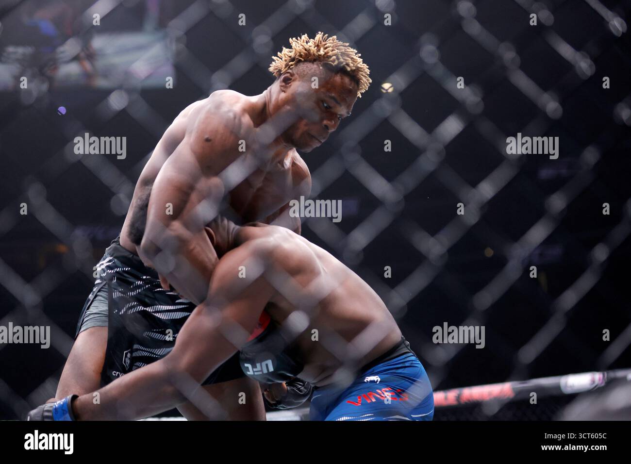Ateba Gautier, left, of Cameroon, fights with Tre'ston Vines, of the ...