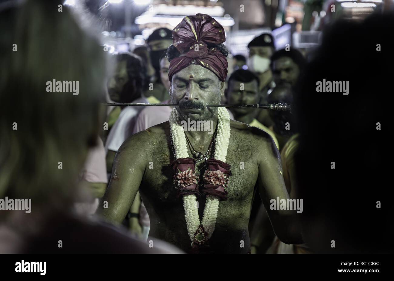 Bangkok, Thailand - 02 Oct, 2025 - a devotee participating in a ritual ...