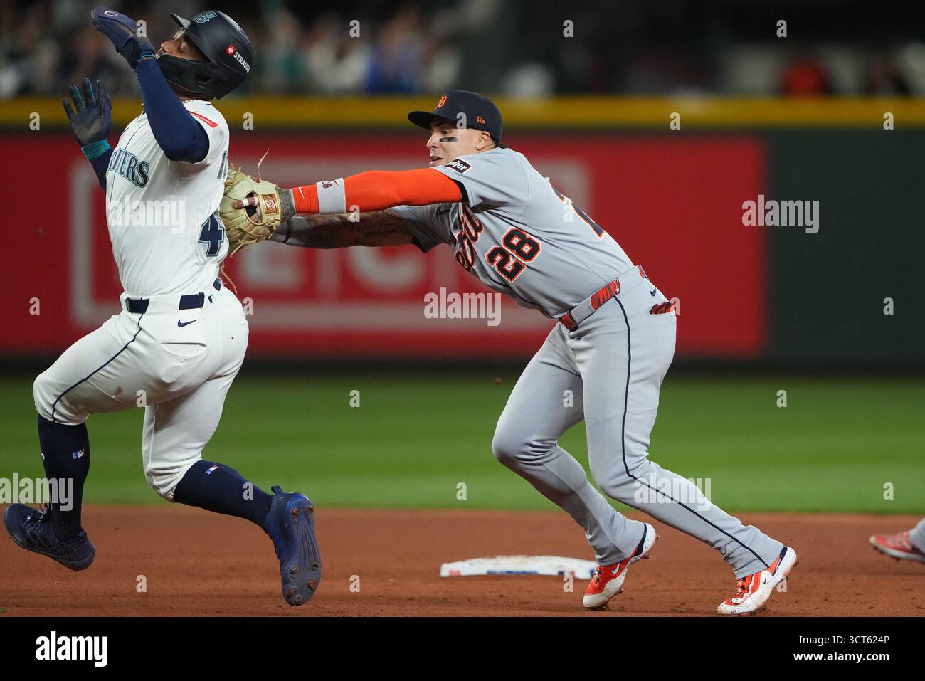 Detroit Tigers center fielder Javier Báez, right, tags out Seattle ...