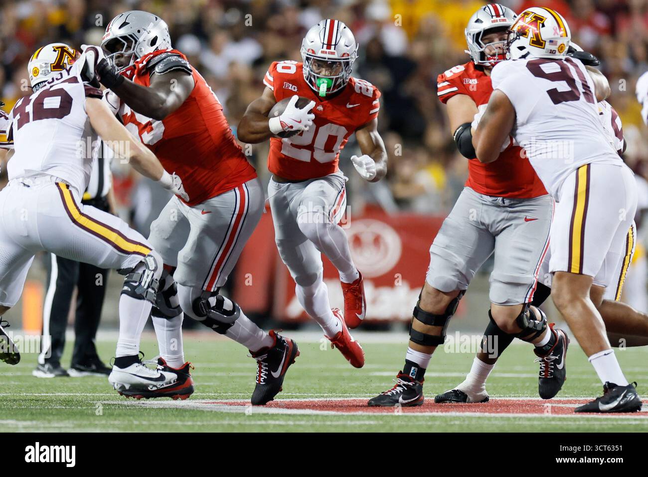 Ohio State running back James Peoples breaks through the line of ...