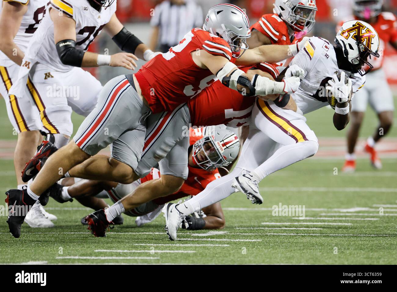 Ohio State defensive lineman Caden Curry, left, and defensive lineman ...