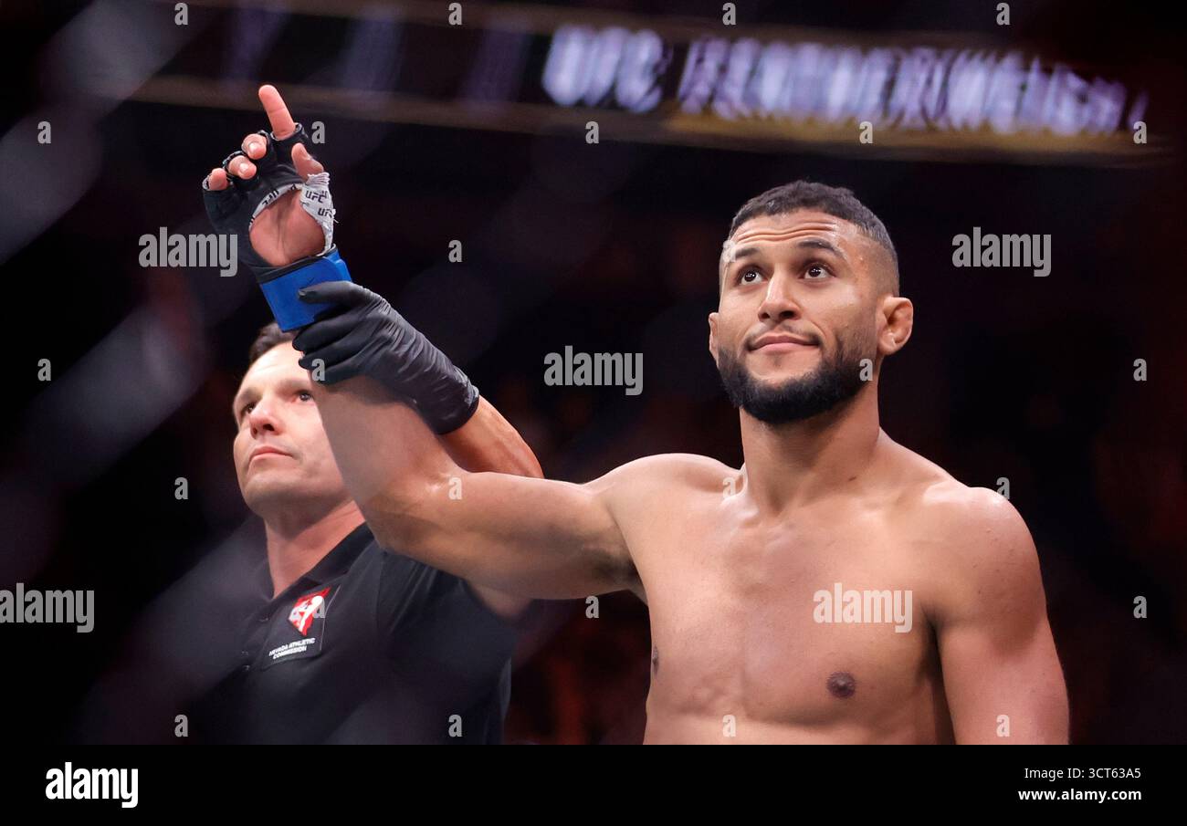 Yousef Zalal, right, of Morocco, has his arm raised after defeating ...