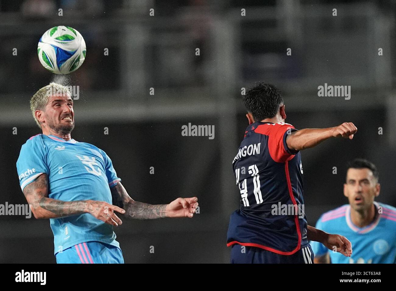 Inter Miami midfielder Rodrigo De Paul, left, heads a ball past New ...