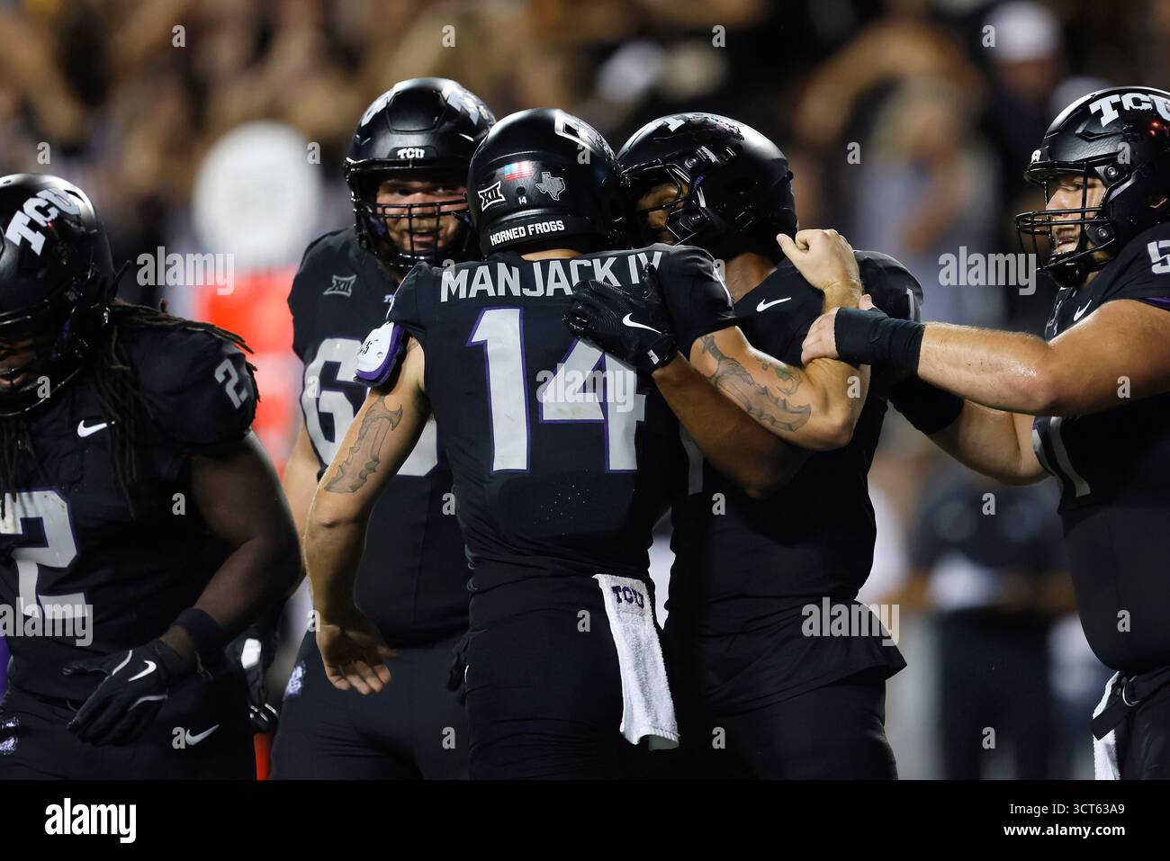 TCU wide receiver Joseph Manjack IV (14) is congratulated by teammates ...