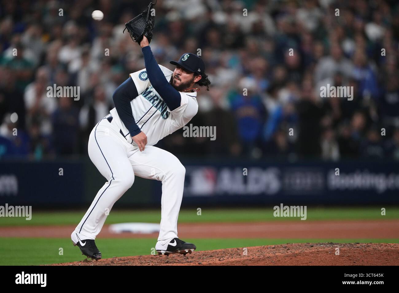 Seattle Mariners relief pitcher Andrés Muñoz catches a line out from ...