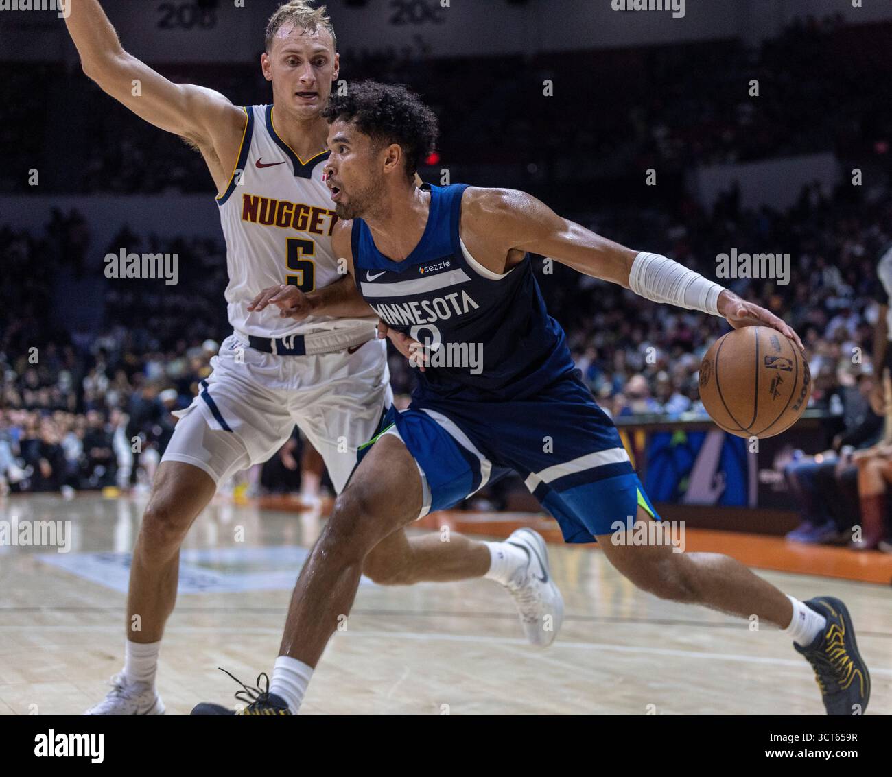 Denver Nuggets forward Hunter Tyson (5) defends against Minnesota Timberwolves guard Johnny ...
