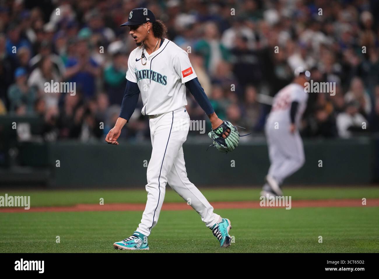 Seattle Mariners pitcher Carlos Vargas reacts while walking off the ...