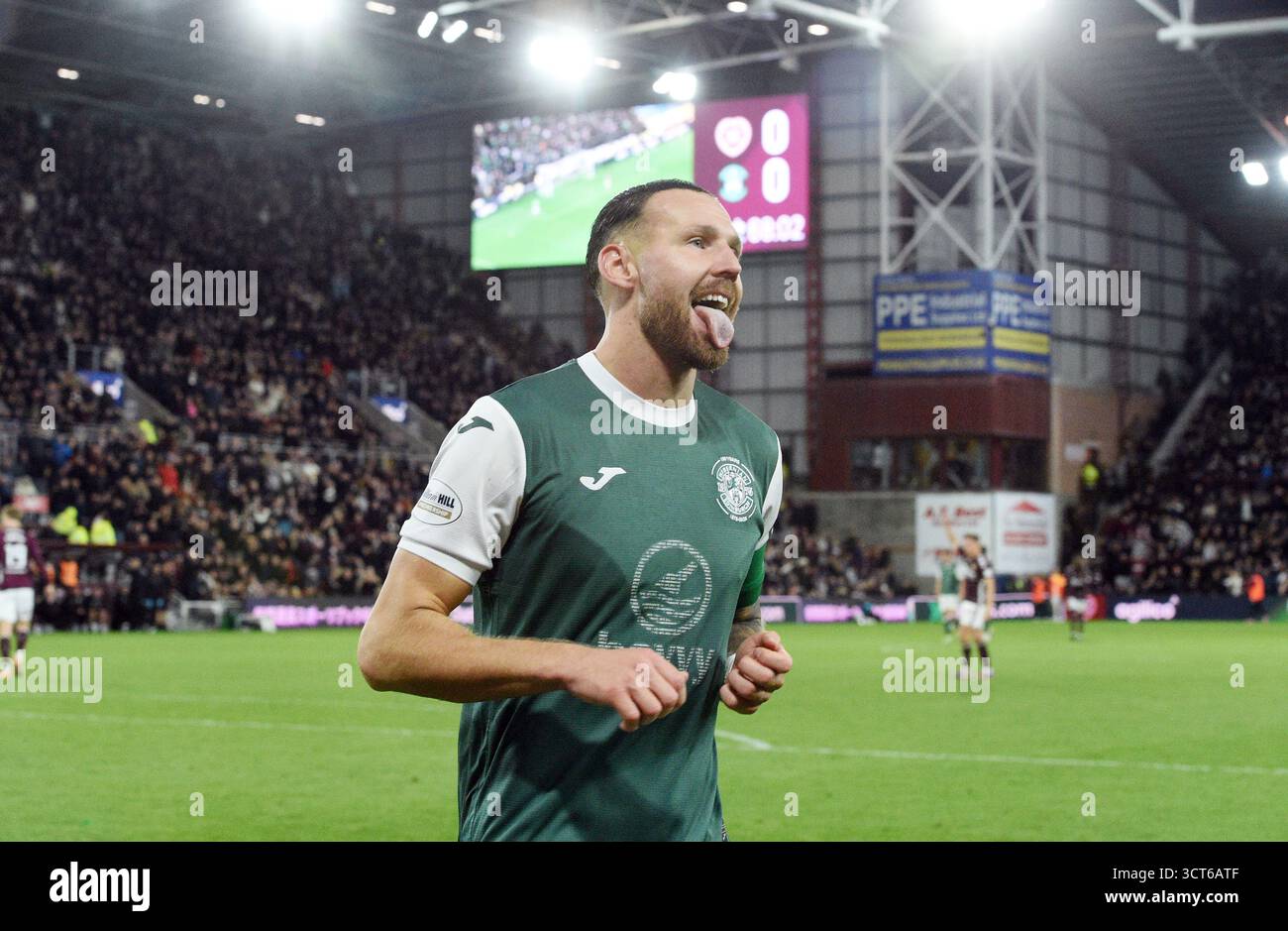 Martin boyle of hibs after his offside goal hi-res stock photography ...