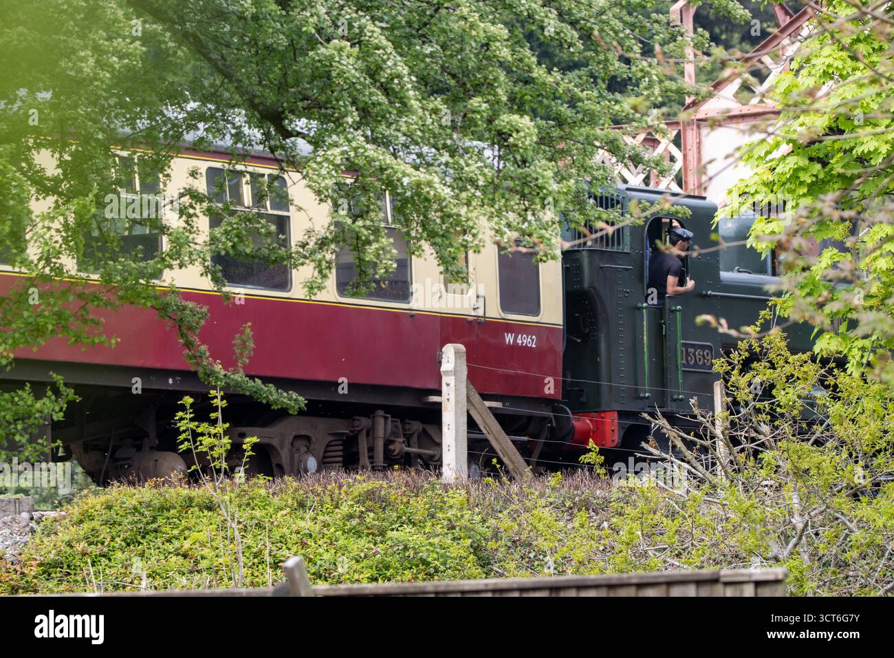 BUCKFASTLEIGH, DEVON, UK - MAY1, 2025 Steam train and carriage glimpse ...
