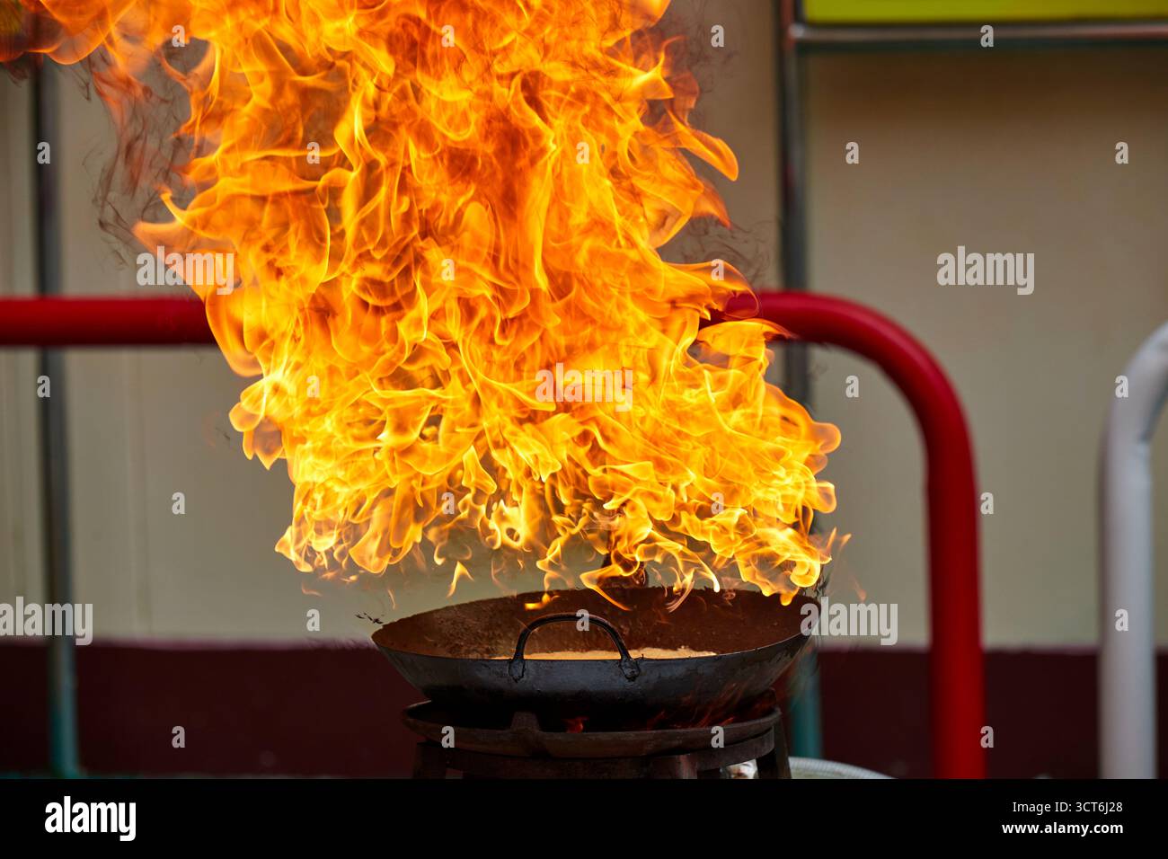 Fire burning in frying pan extinguishing approach training Stock Photo ...