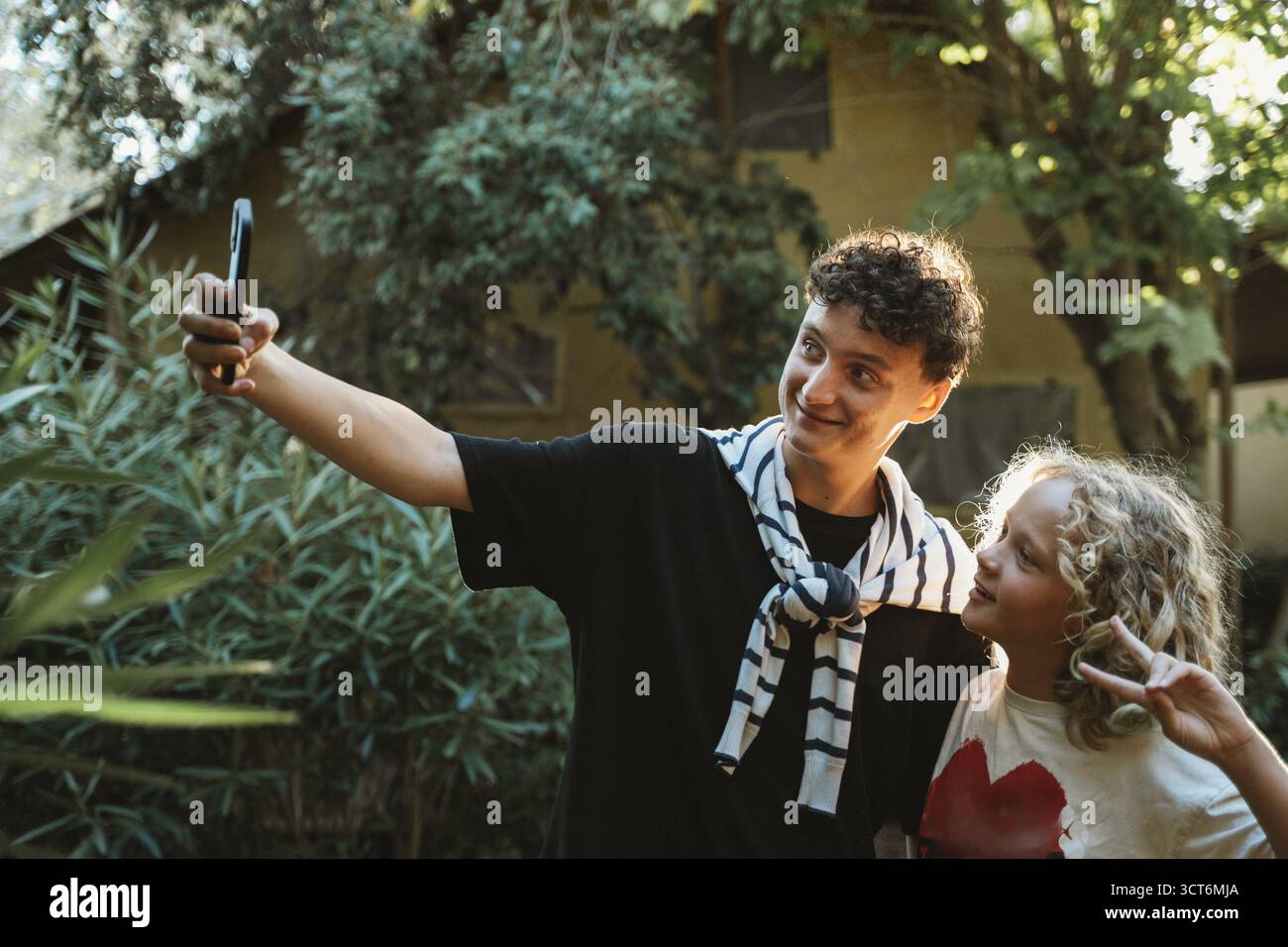 Siblings capture joyful selfie hi-res stock photography and images - Alamy