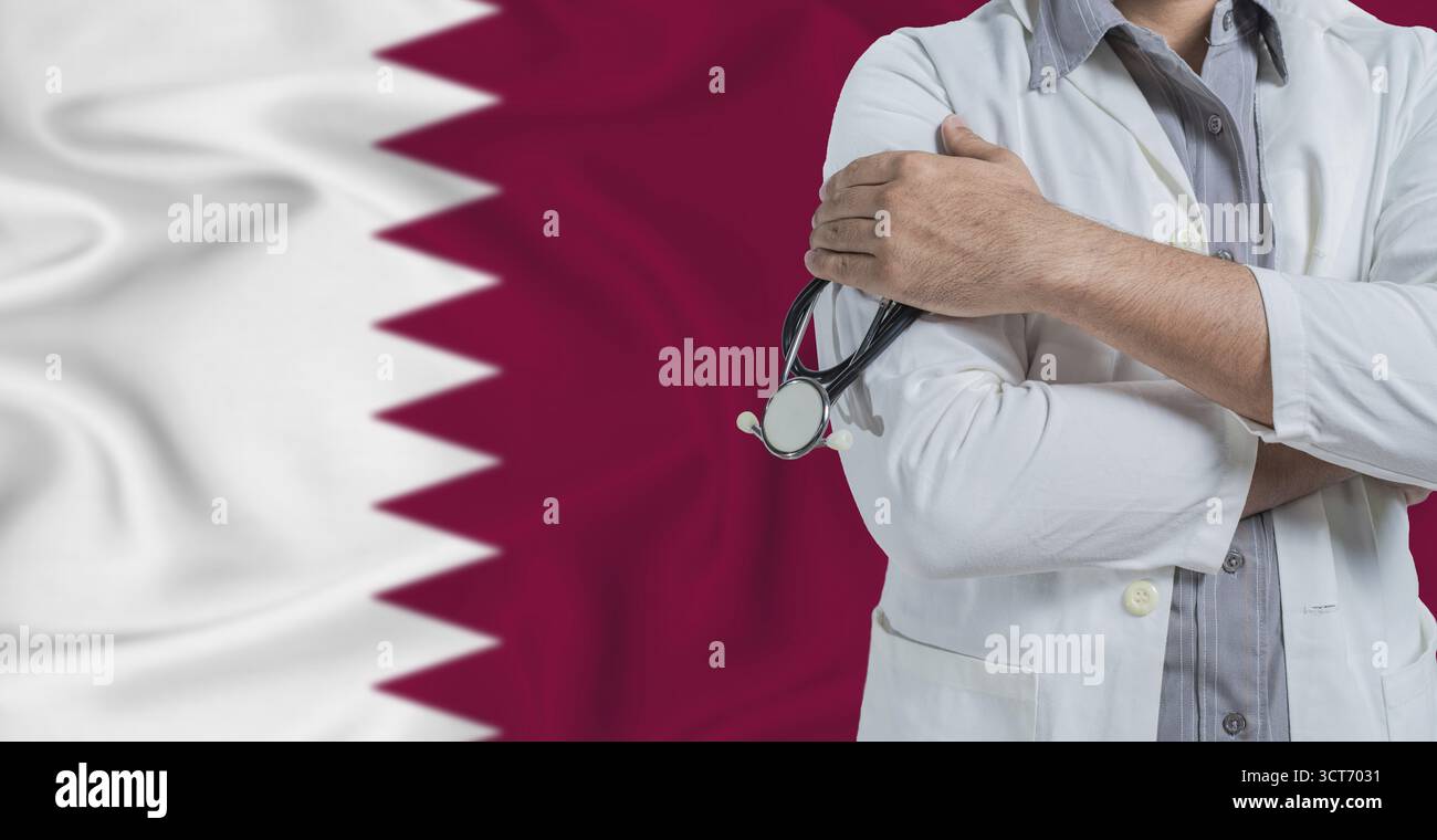 Doctor with stethoscope on arm with Qatar flag behind. National health ...