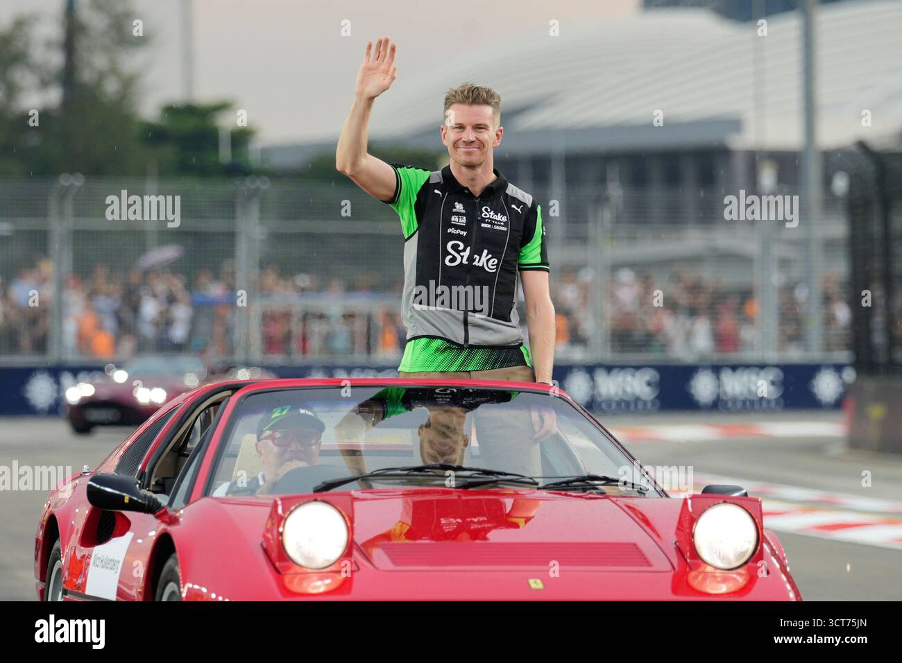 Kick Sauber driver Nico Hulkenberg of Germany waves to fans during the ...